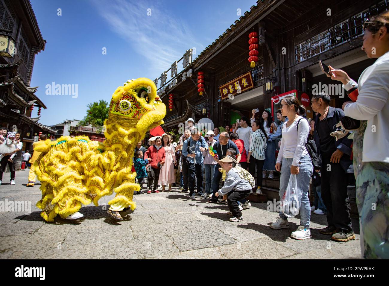 Xiushan, China's Chongqing. 30th Apr, 2023. Tourists watch lion dance ...