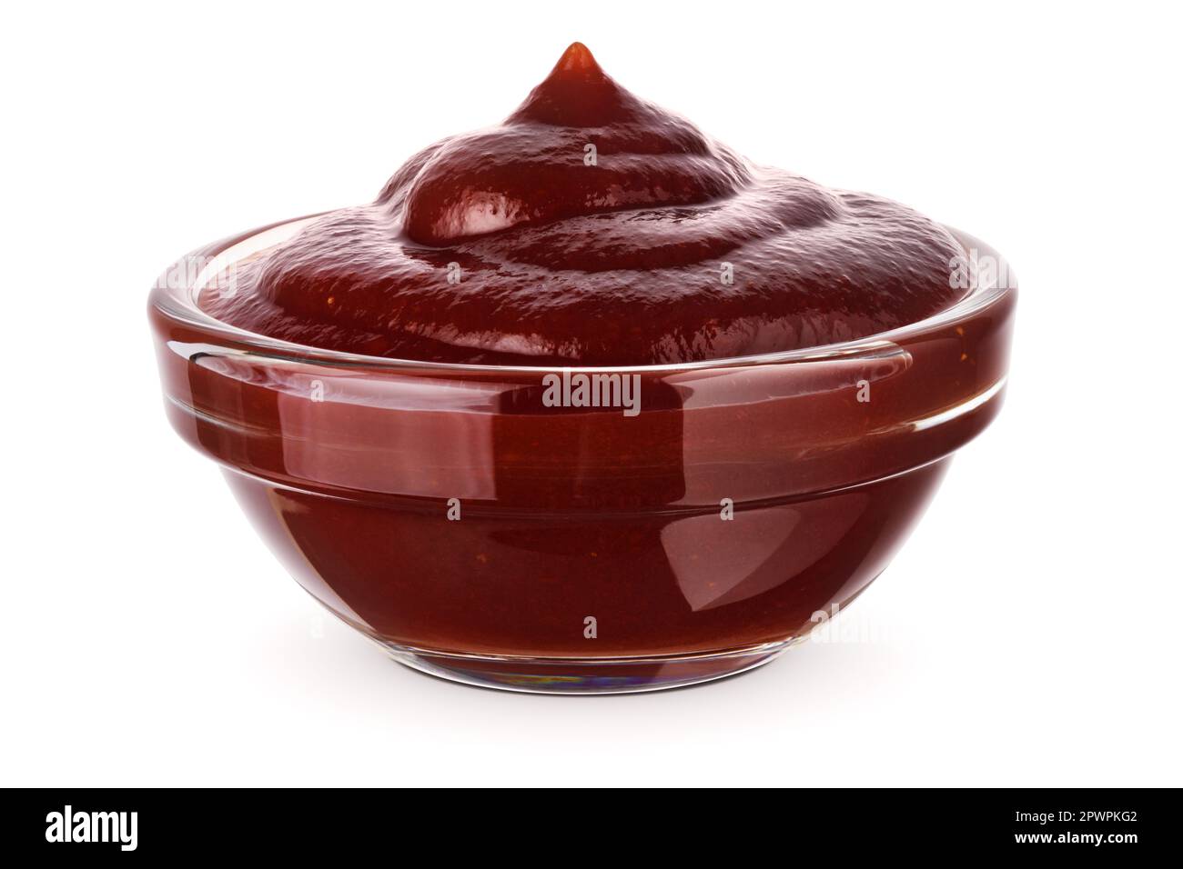 Barbecue sauce in glass transparent bowl, close-up. Isolated on white ...
