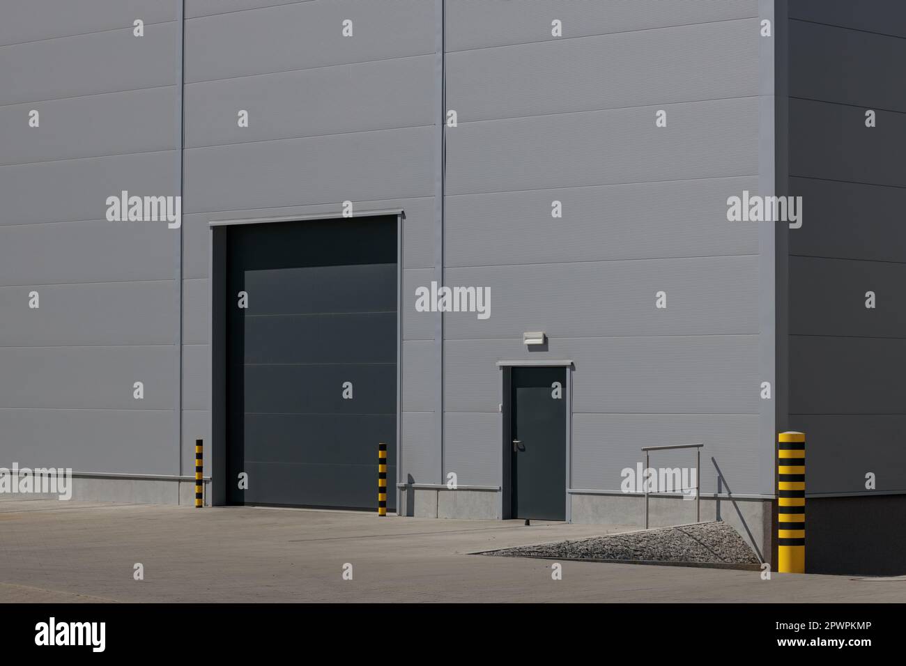 Roller shutter entrance to industrial loading area Stock Photo - Alamy