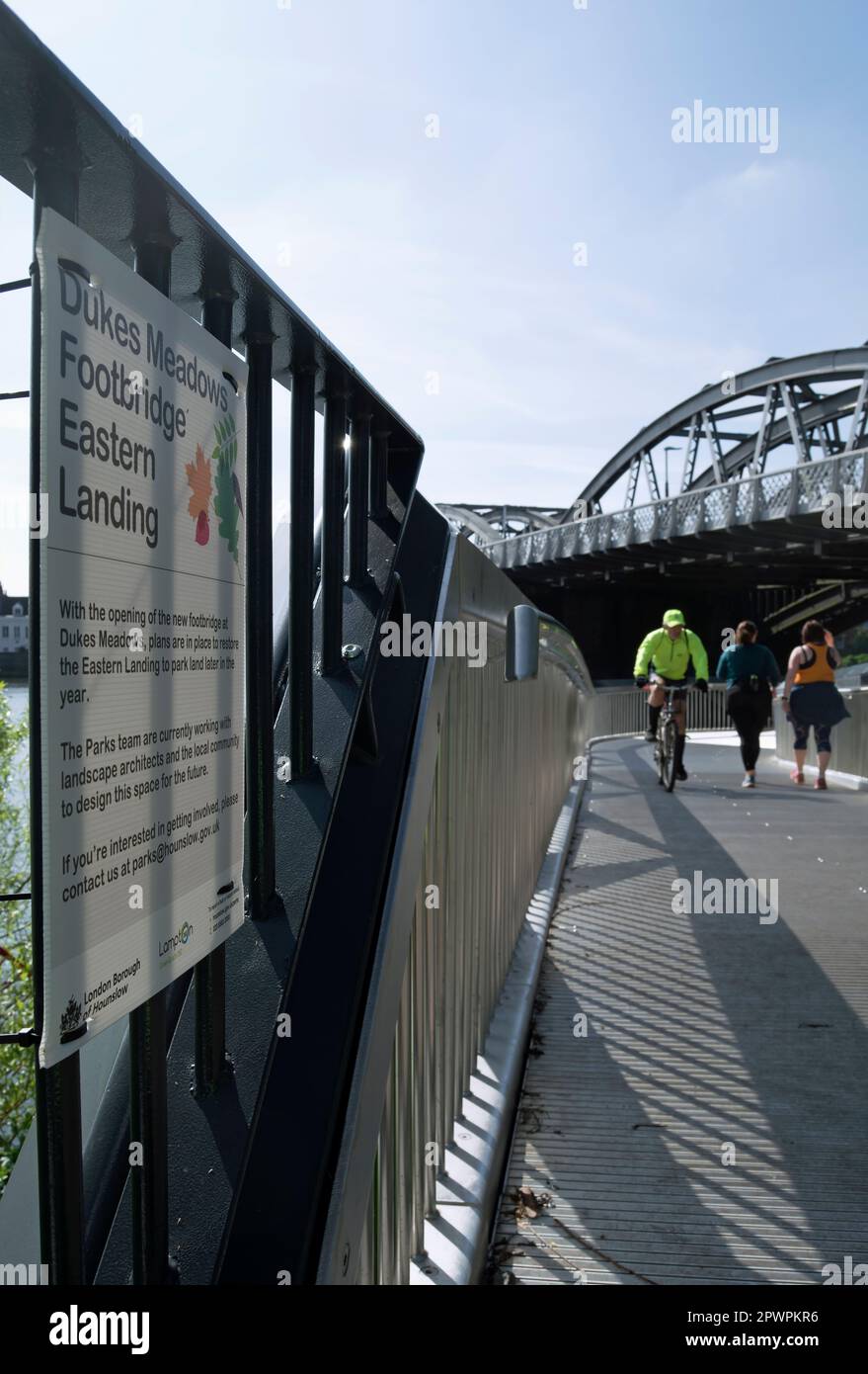cyclist and walkers on dukes meadows footbridge, below barnes bridge on ...