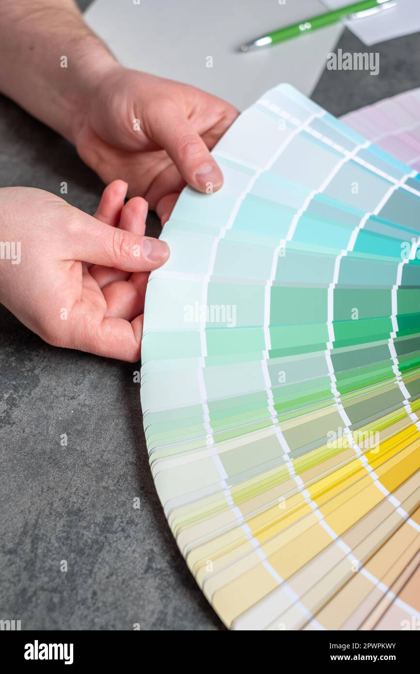 Hands designer or architect choosing swatch the colors painting of the ...