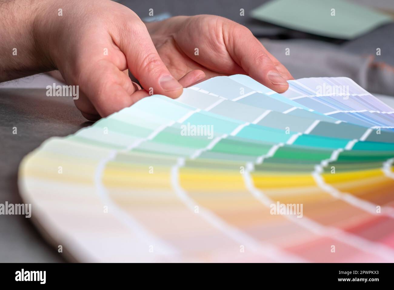 Hands designer or architect choosing swatch the colors painting of the ...
