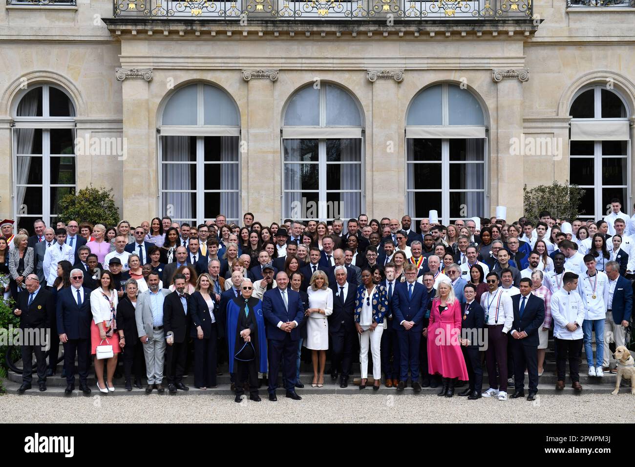 France's President Emmanuel Macron (2ndROW-C) and his wife Brigitte ...