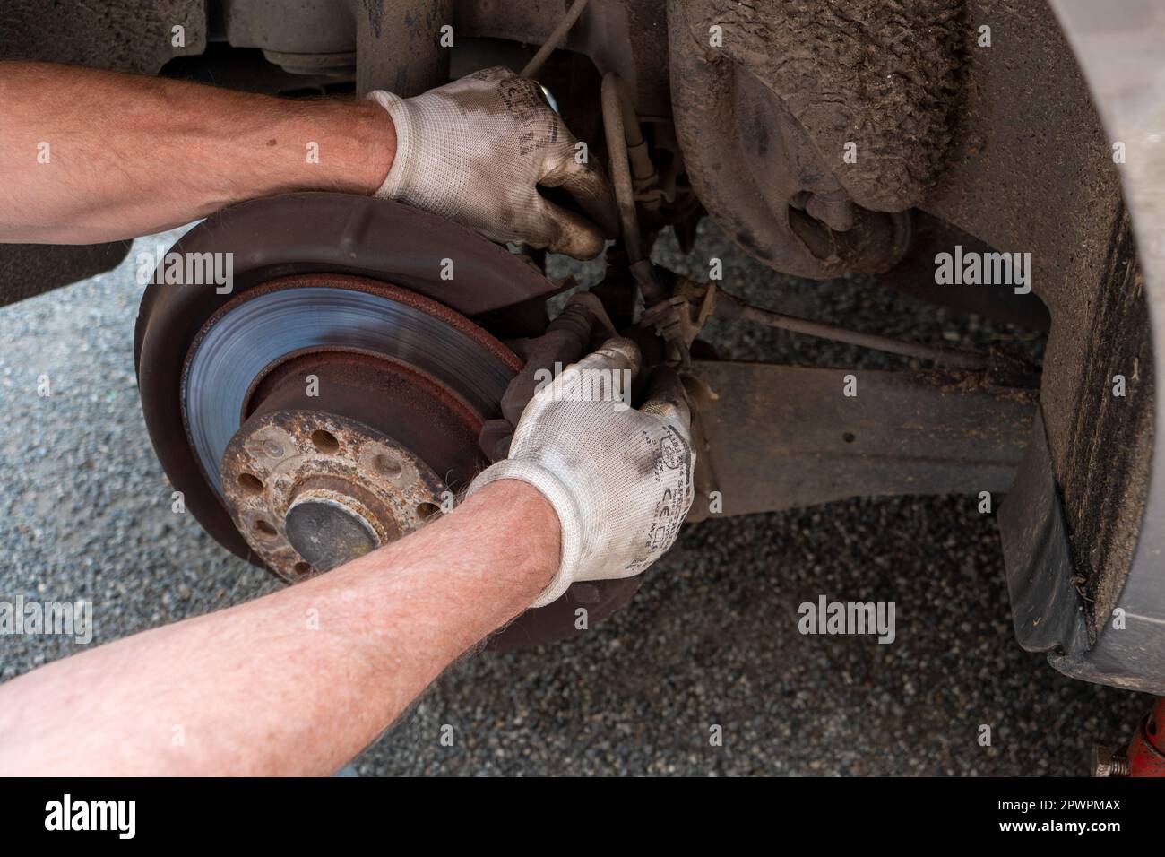 Auto mechanic working on brakes hi-res stock photography and images - Alamy
