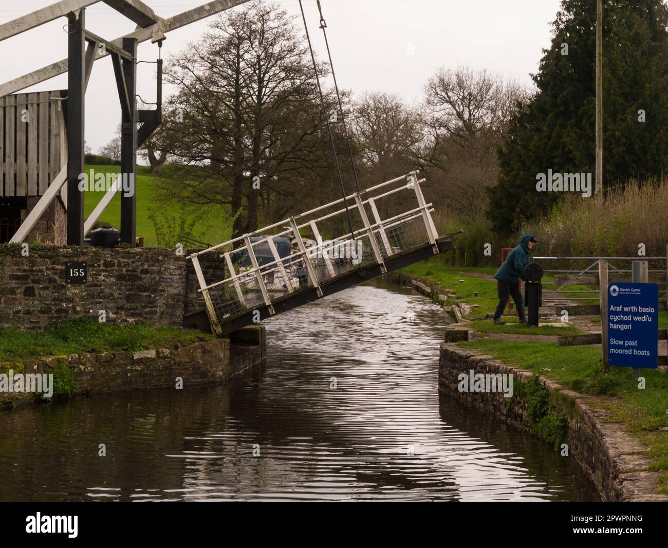 Female narrowboat passenger winding winch to open bridge 155 hi-res ...