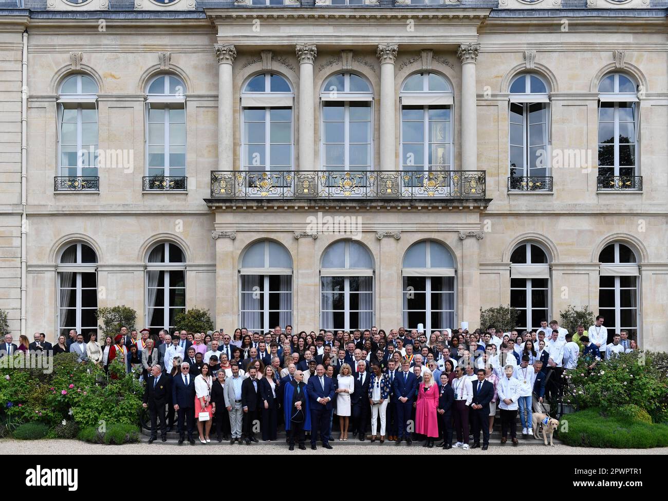 France's President Emmanuel Macron (2ndROW-C) and his wife Brigitte ...