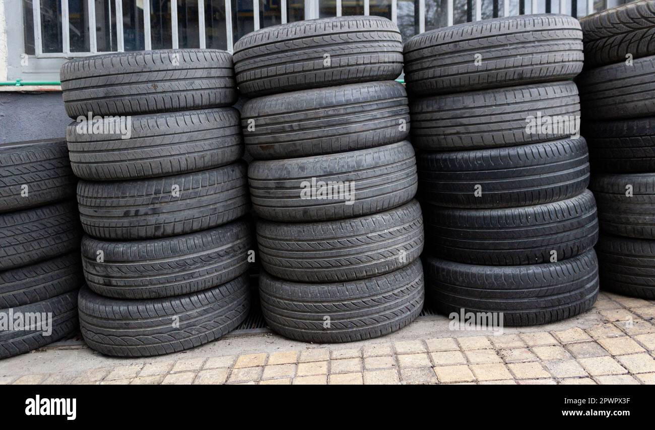 Tires stacked on each other Stock Photo - Alamy