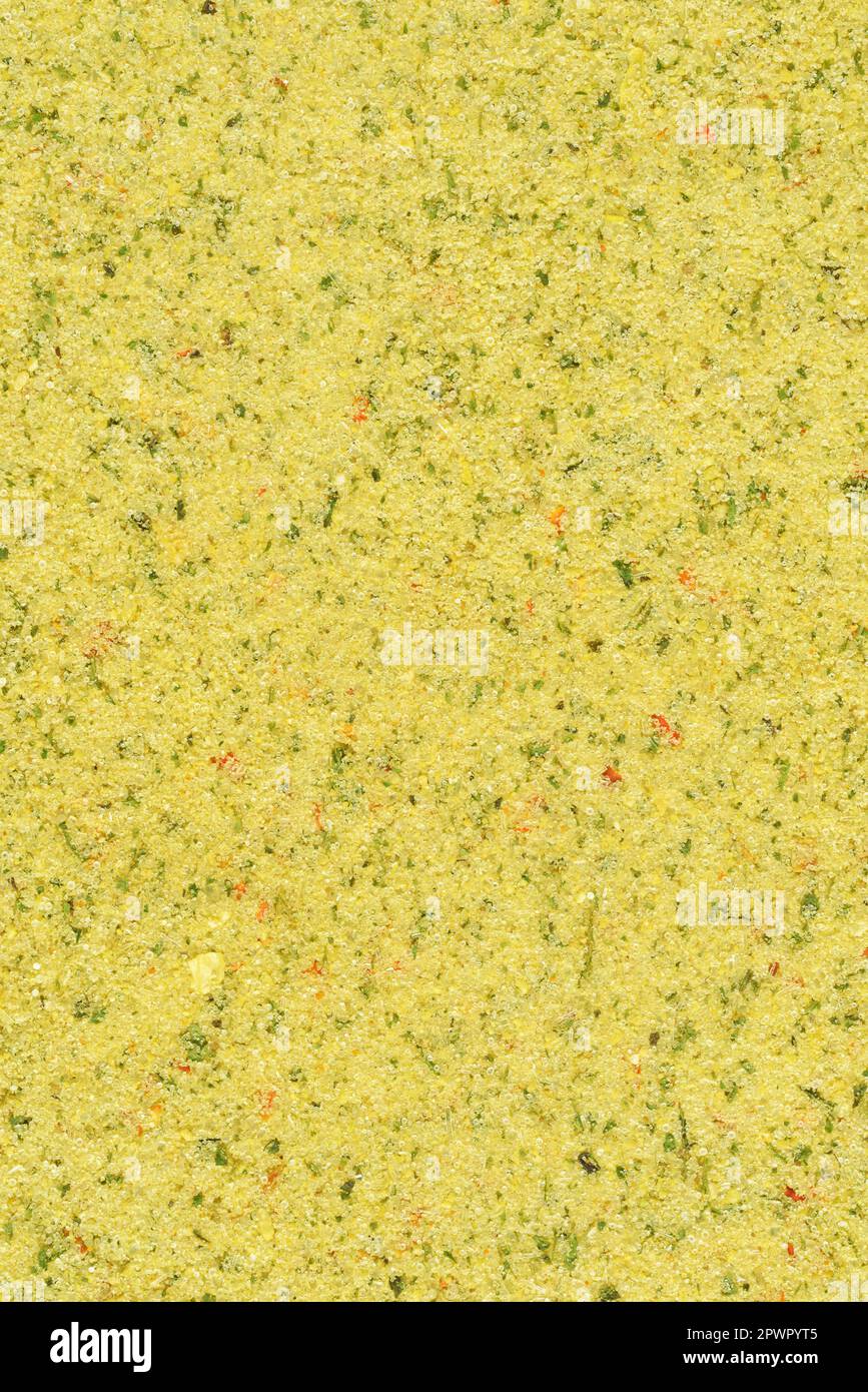 Yellow chicken stock powder seasoning texture or background Stock Photo ...