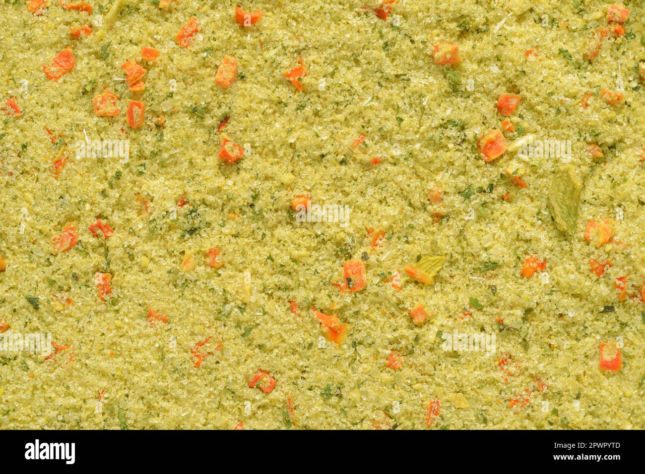 Yellow chicken stock powder seasoning texture or background Stock Photo ...