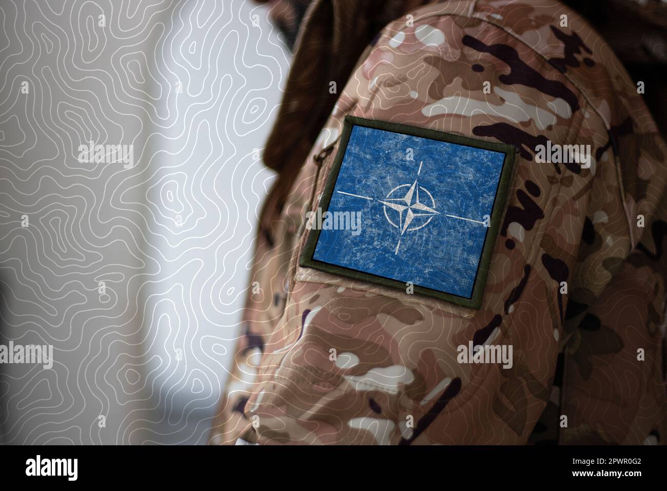 NATO Soldier. Soldier with flag NATO, NATO flag on a military uniform ...