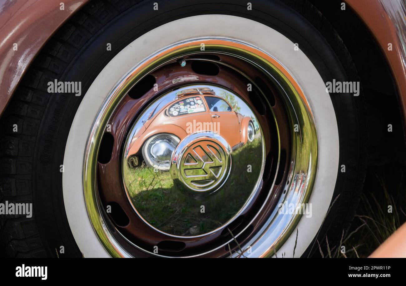 Hanover, Germany. 01st May, 2023. A Volkswagen Beetle is reflected in ...