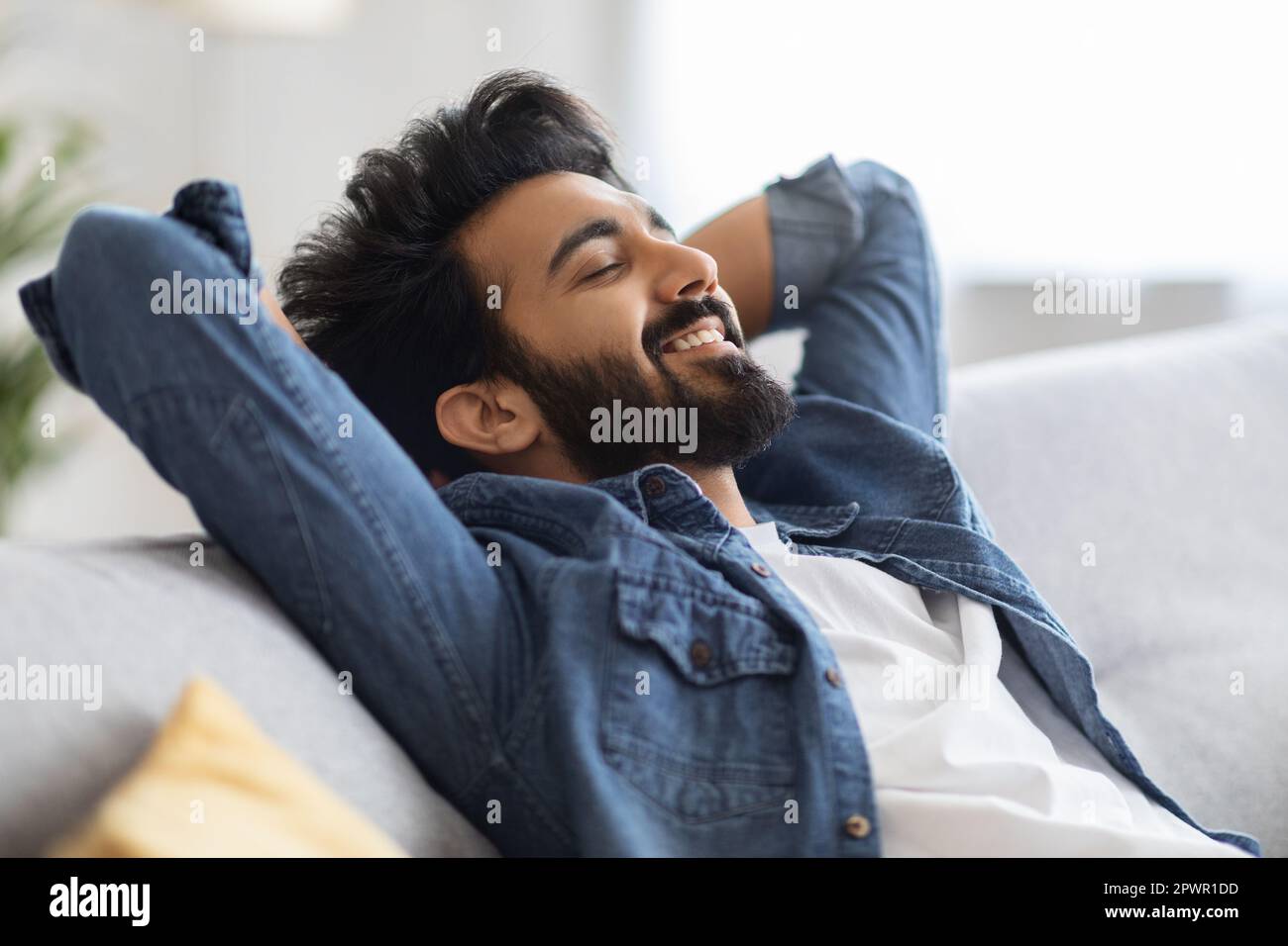 Home Comfort. Portrait Of Relaxed Young Indian Man Leaning Back On ...