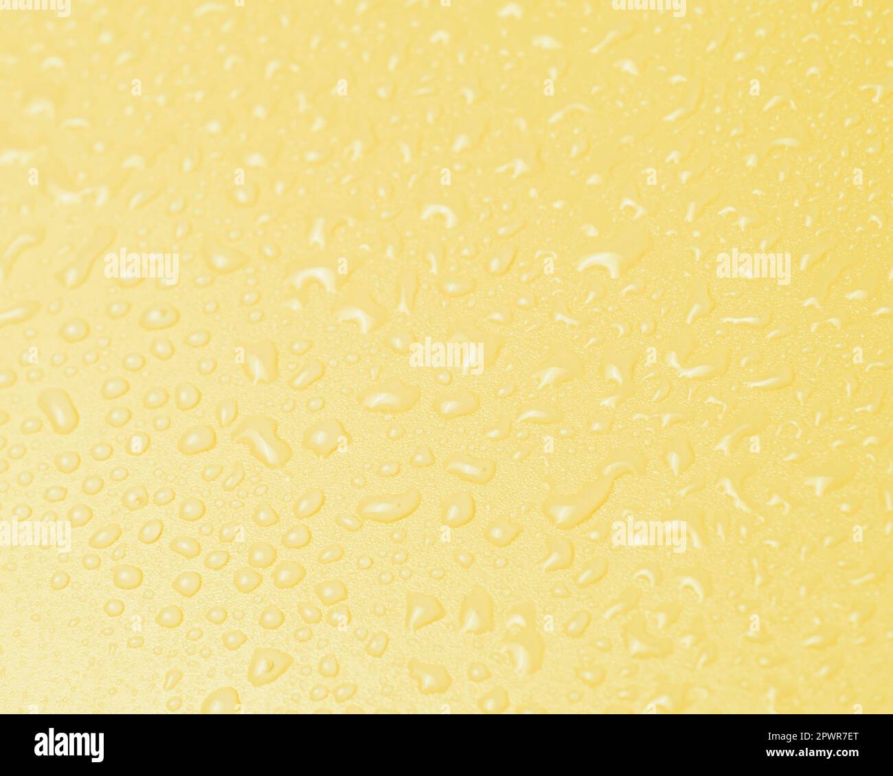 Yellow water drops background texture macro photo Stock Photo - Alamy