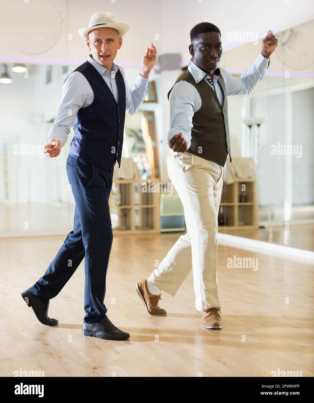 African-american and caucasian men dancing swing Stock Photo - Alamy