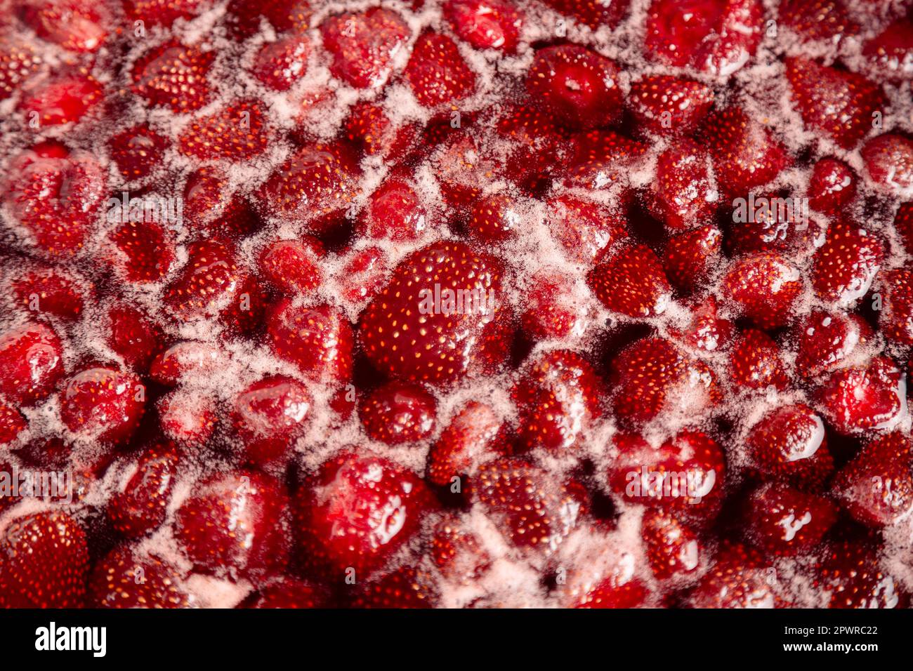 TOP VIEW, CLOSE UP: Strawberry jam in making progress boiling. Process ...