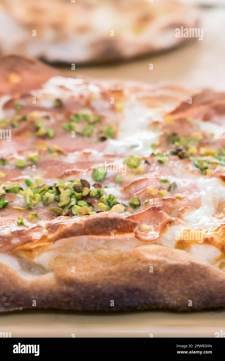 Italian pizza close-up. Close up of italian pizza on cutting board ...