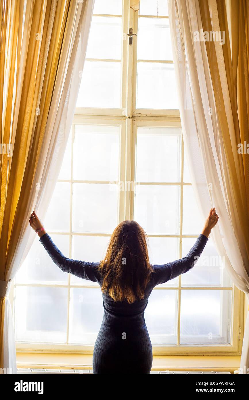 The girl at the window in the ancient room in the House of Scientists ...