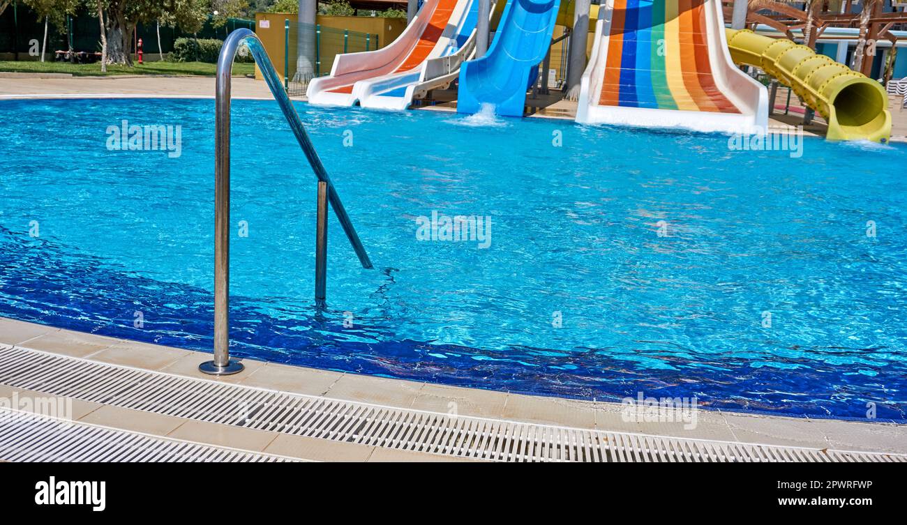 Colorful kids waterpark and a swimming pool Stock Photo - Alamy