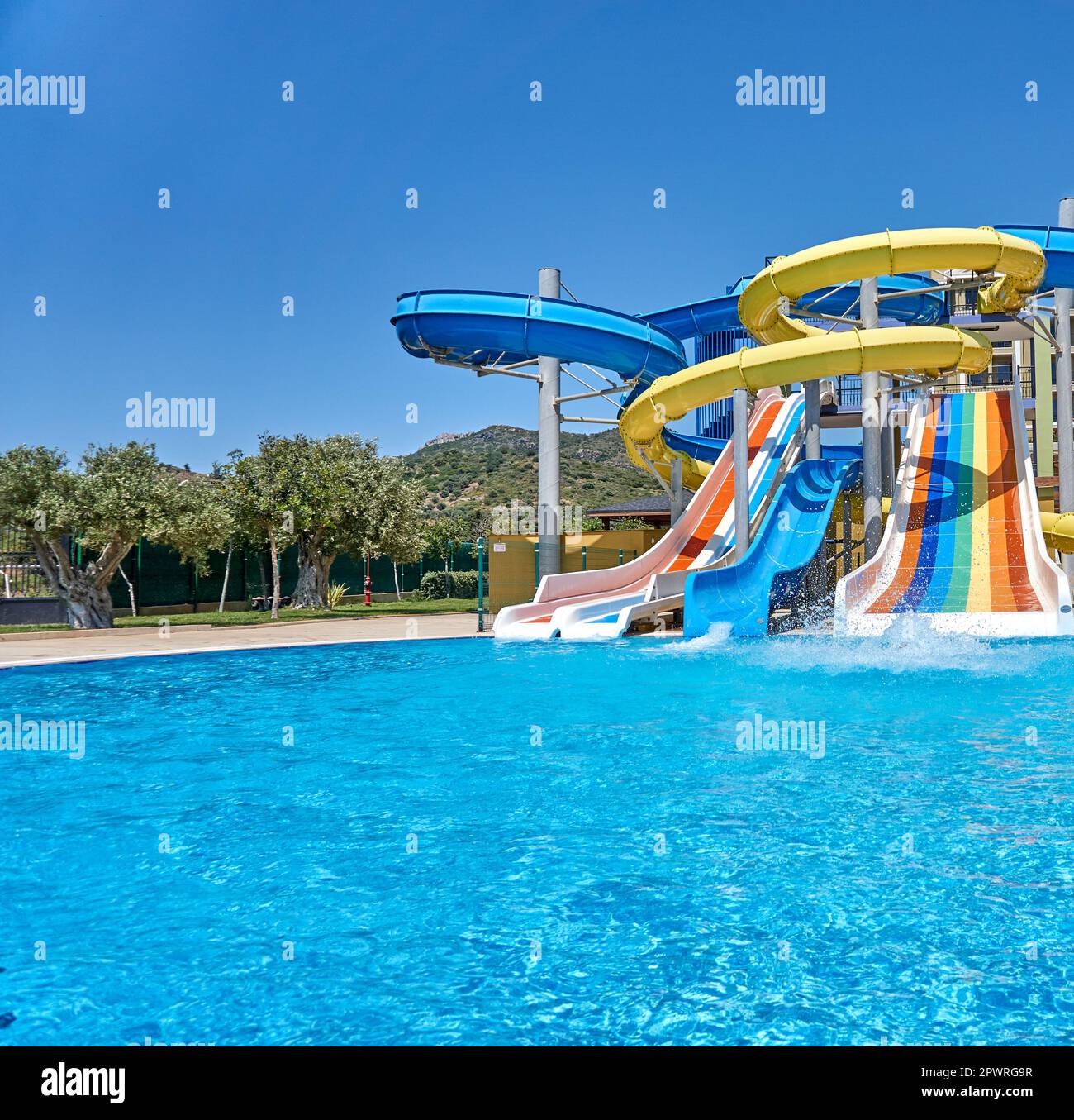 Colorful kids waterpark and a swimming pool Stock Photo - Alamy
