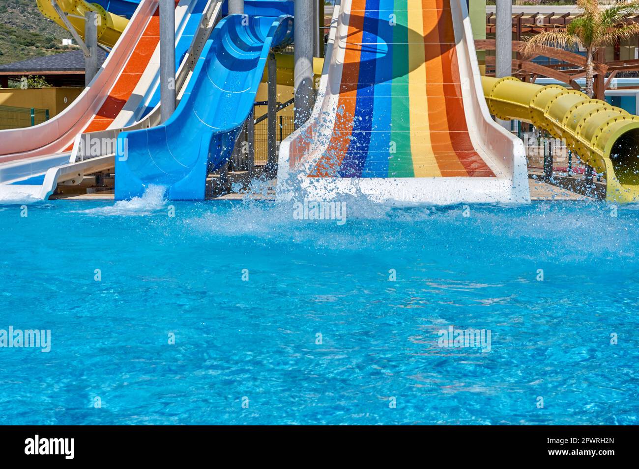 Colorful kids waterpark and a swimming pool Stock Photo - Alamy