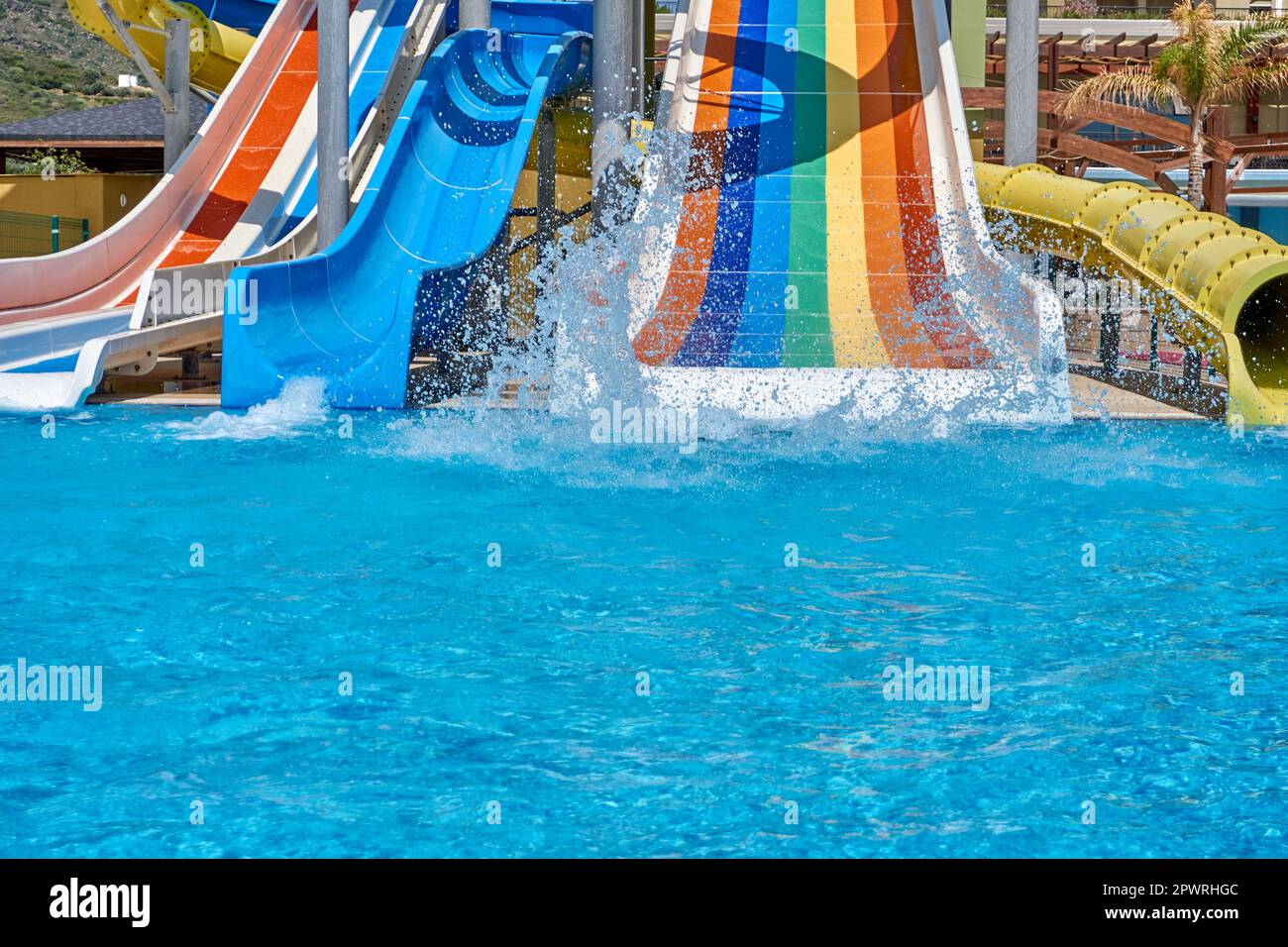 Colorful kids waterpark and a swimming pool Stock Photo - Alamy