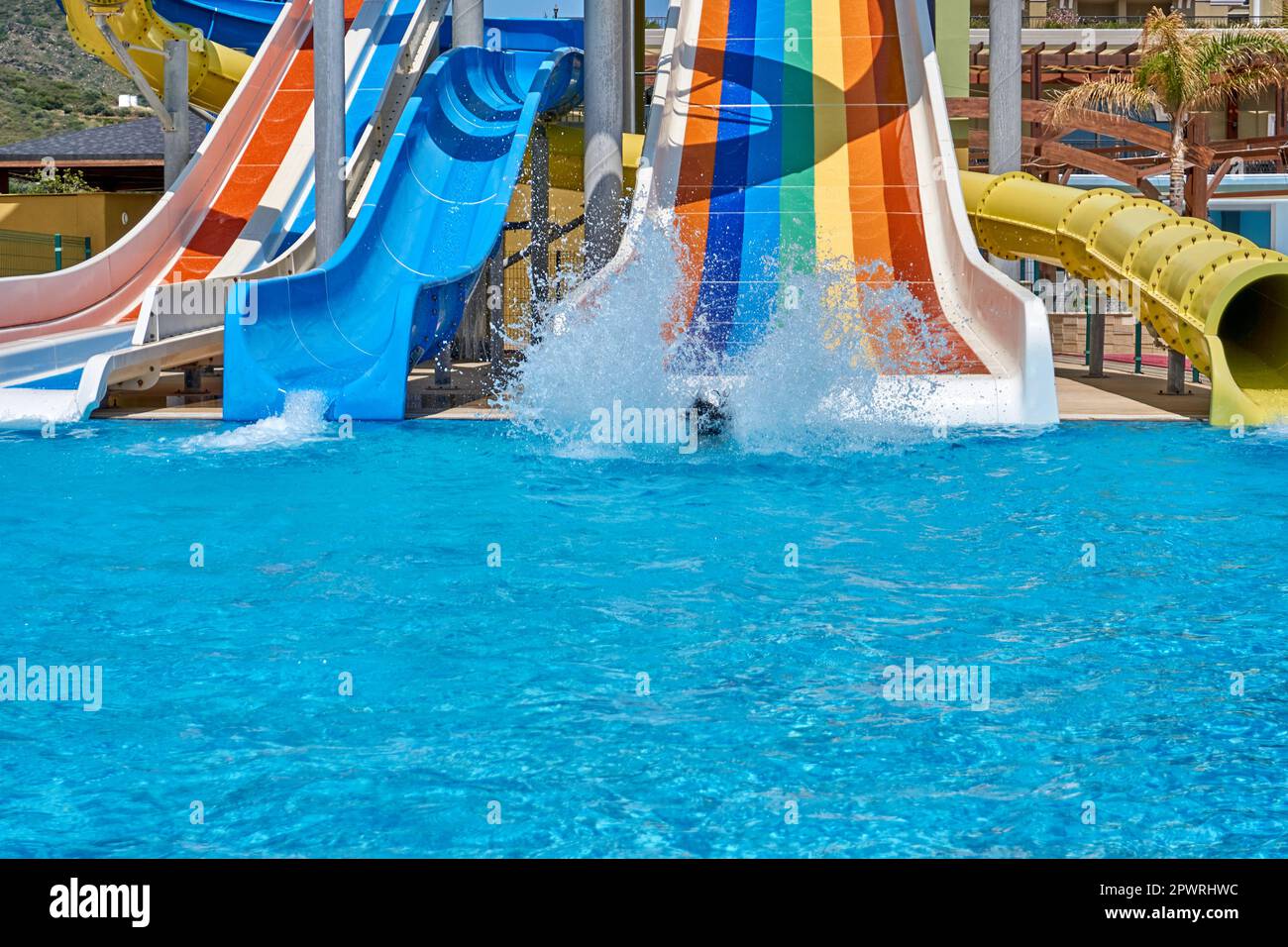 Colorful kids waterpark and a swimming pool Stock Photo - Alamy