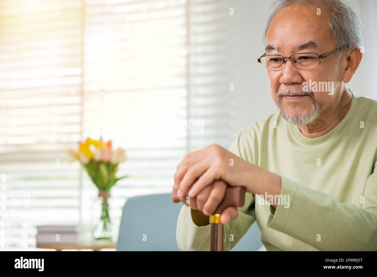 Closeup hands of senior disabled man holding walking stick, Old man ...