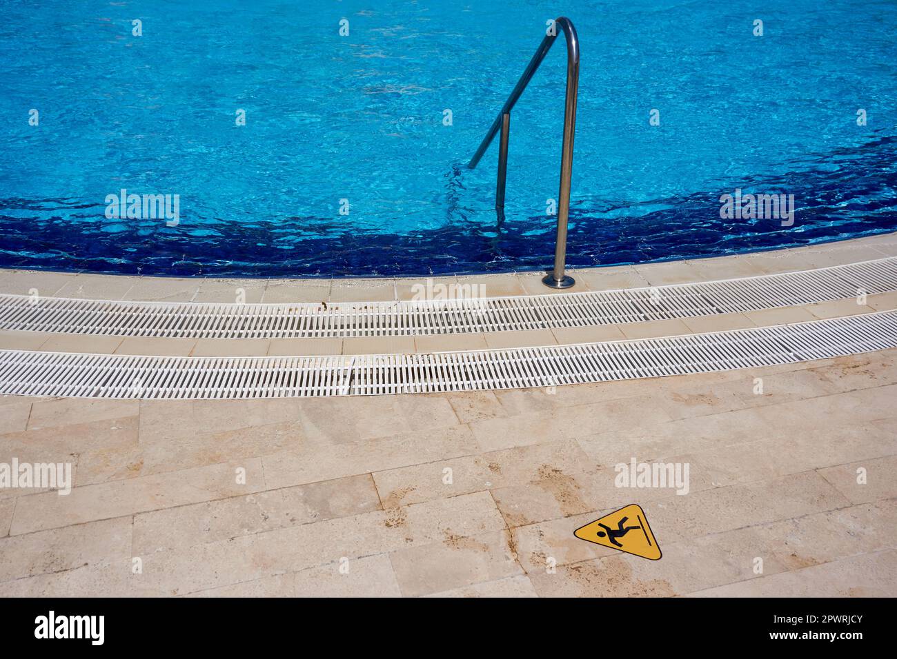 Wet floor warning sign on a swimming pool Stock Photo - Alamy