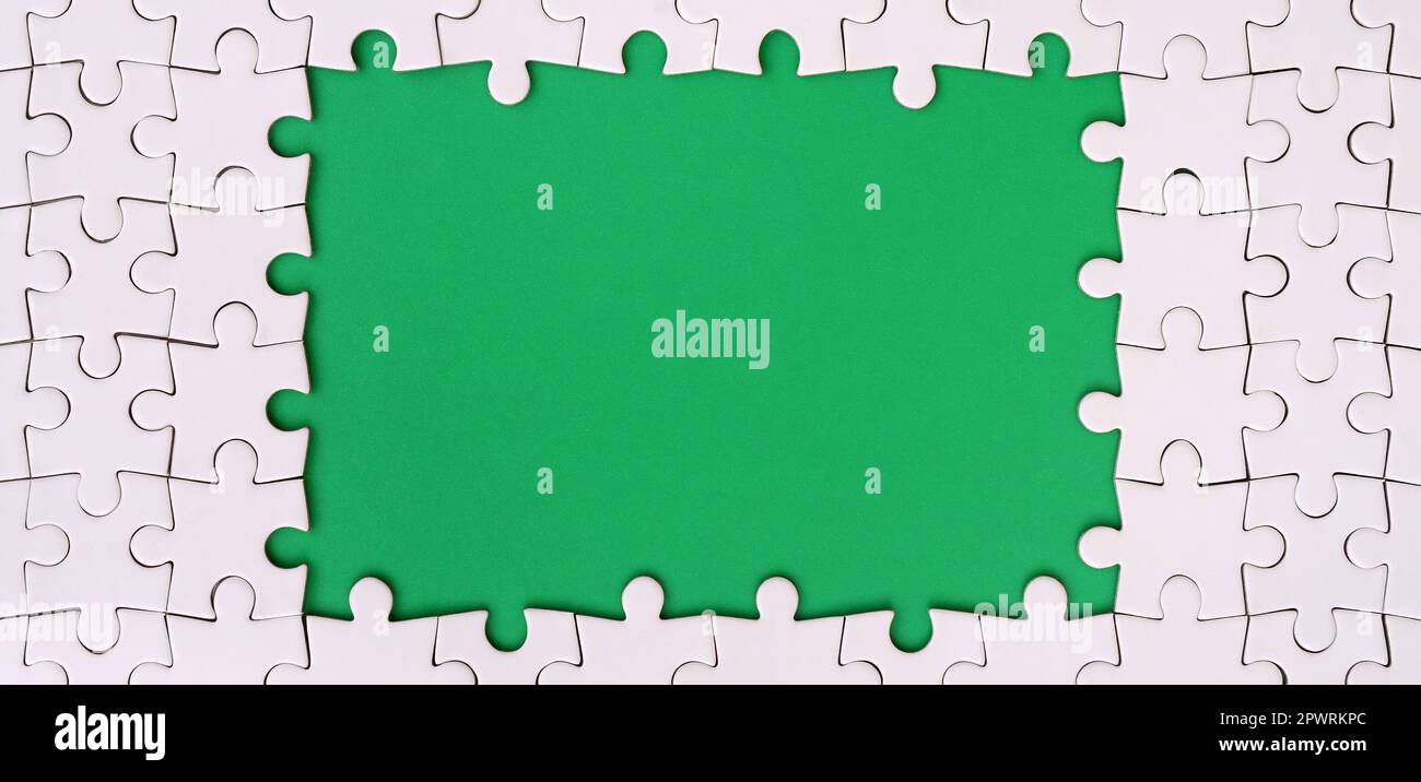 Framing in the form of a rectangle, made of a white jigsaw puzzle ...