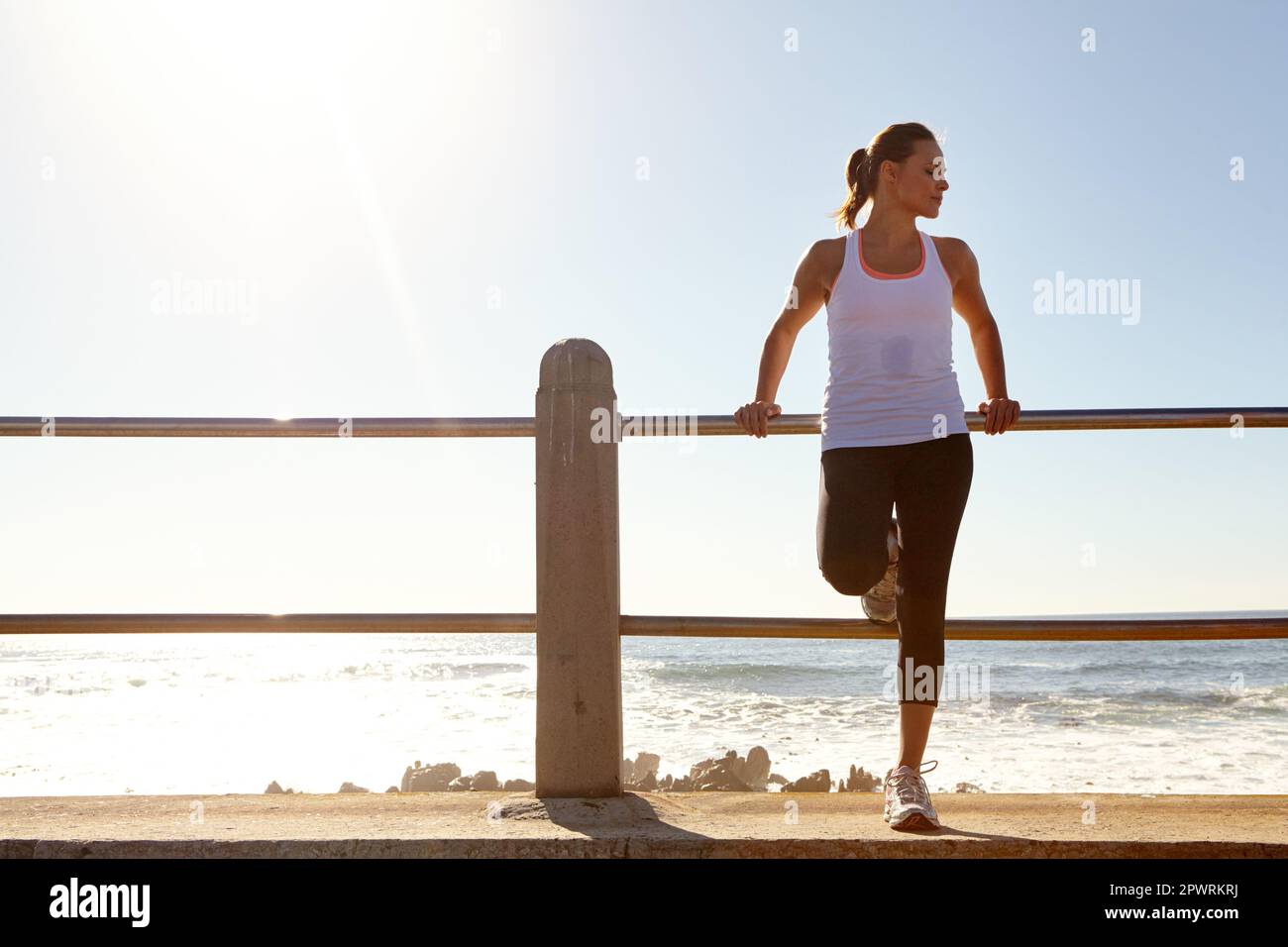 Sweat is fat crying. a woman resting after a long jog by the beach ...