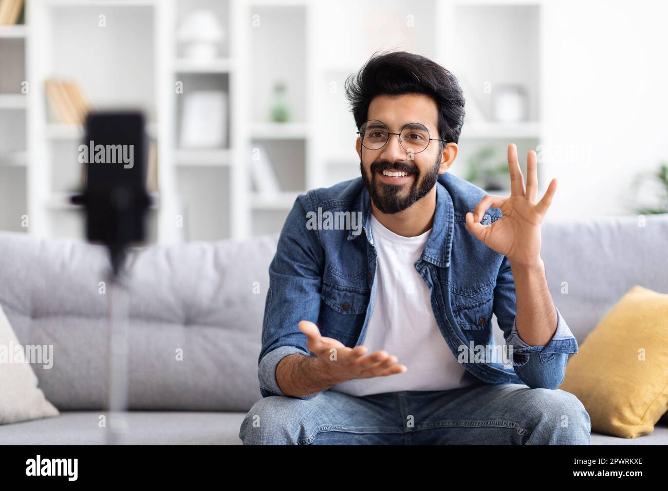 Indian male blogger recording video hi-res stock photography and images ...