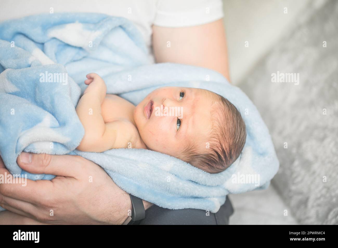 Father with his son, tiny infant. Newborn baby smiling, laughing and ...