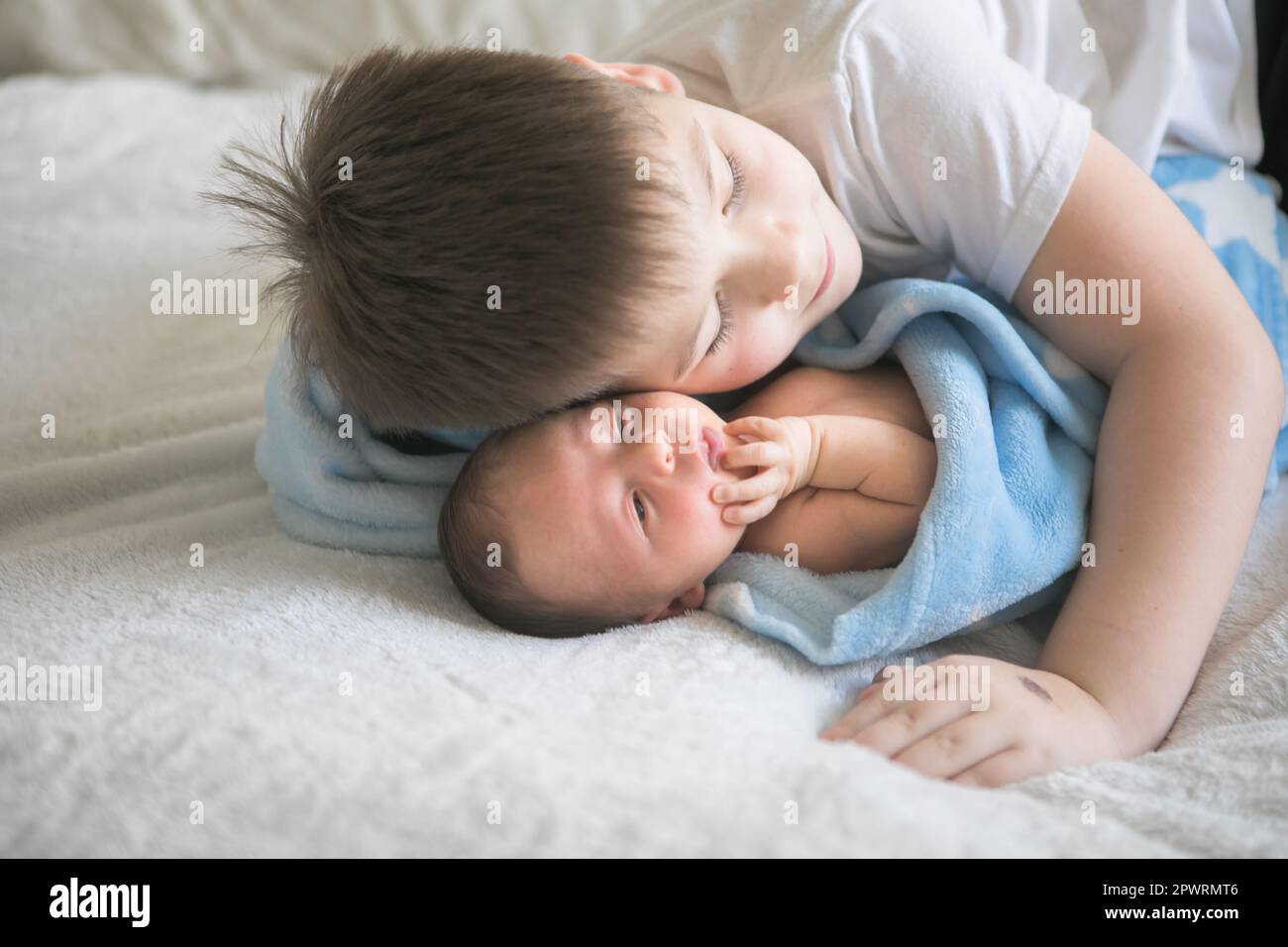 happy little kid boy with his newborn baby brother Stock Photo - Alamy