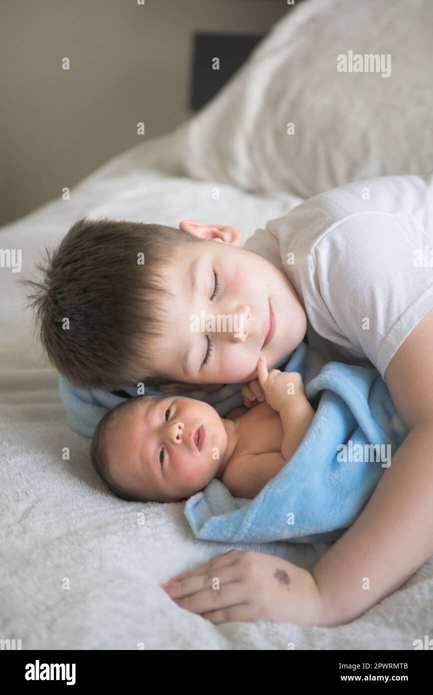 happy little kid boy with his newborn baby brother Stock Photo - Alamy