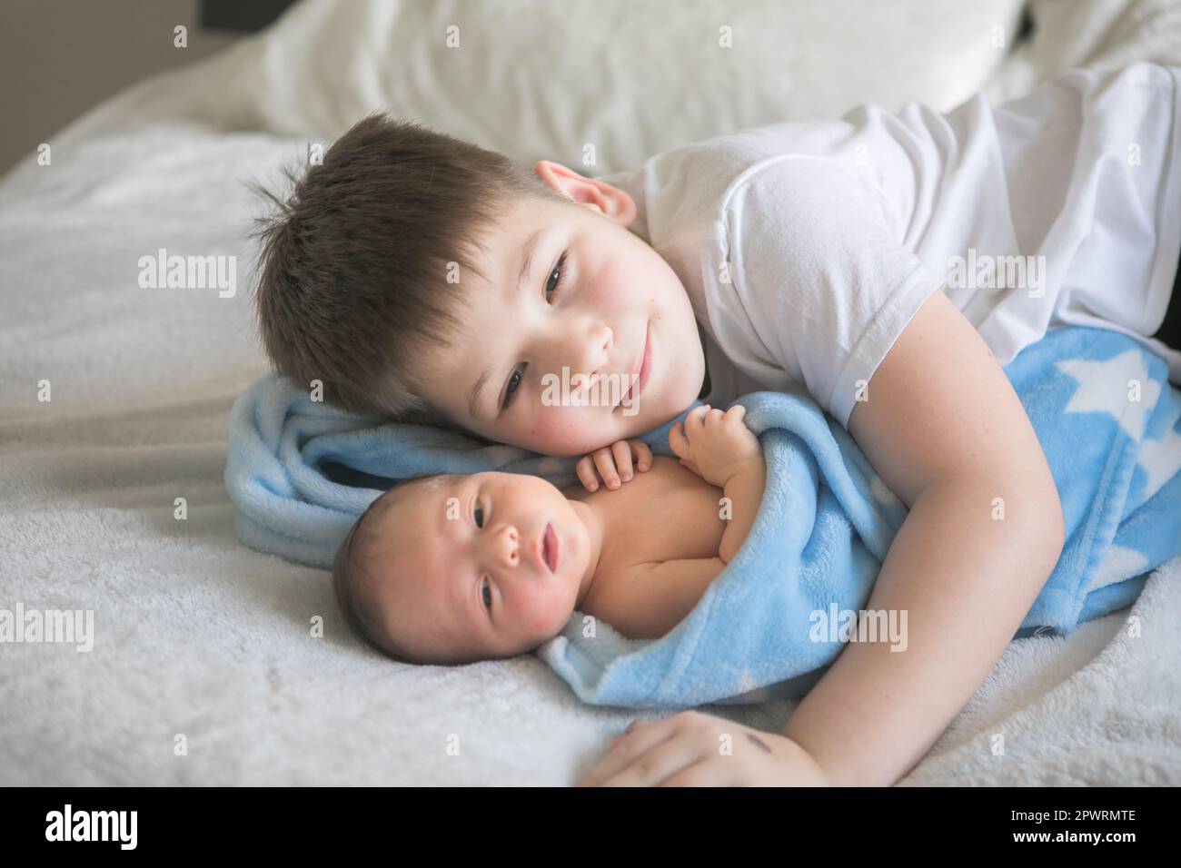 happy little kid boy with his newborn baby brother Stock Photo - Alamy