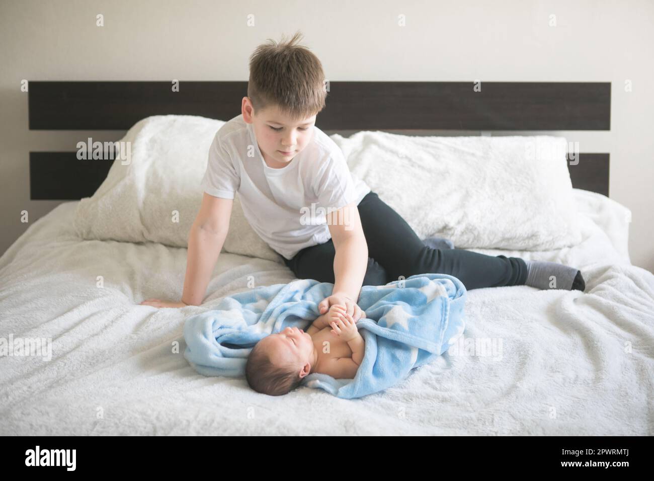 happy little kid boy with his newborn baby brother Stock Photo - Alamy