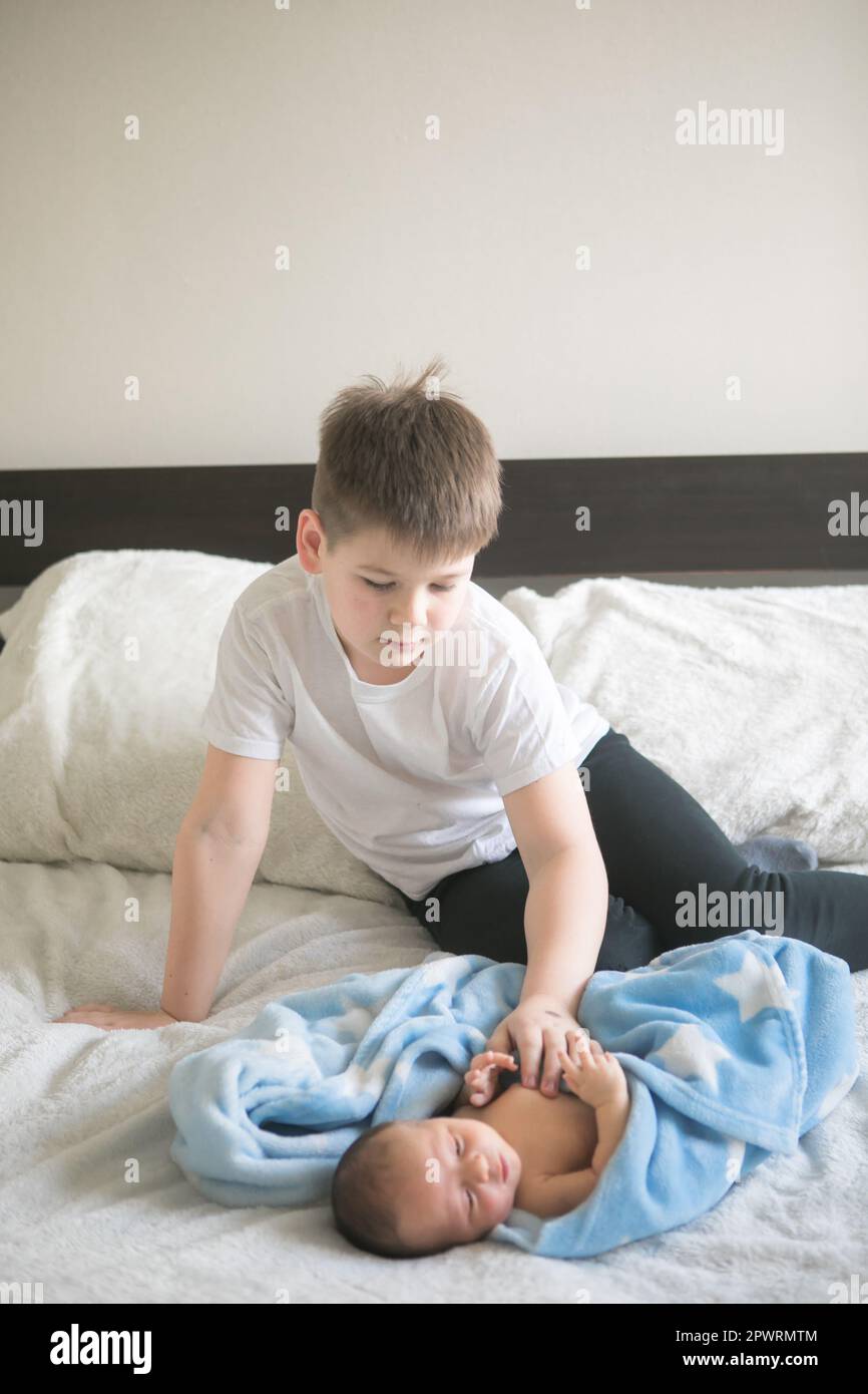 happy little kid boy with his newborn baby brother Stock Photo - Alamy