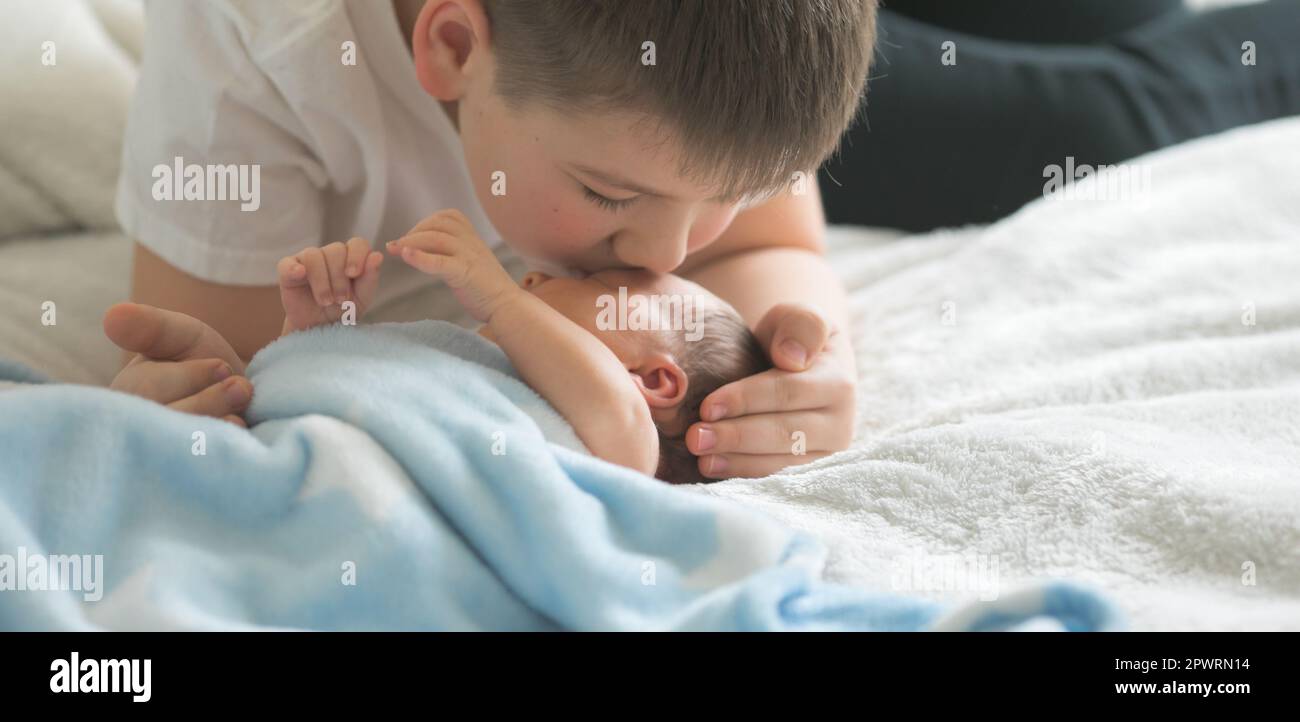 Big brother with his little newborn brother. love family concept Stock ...