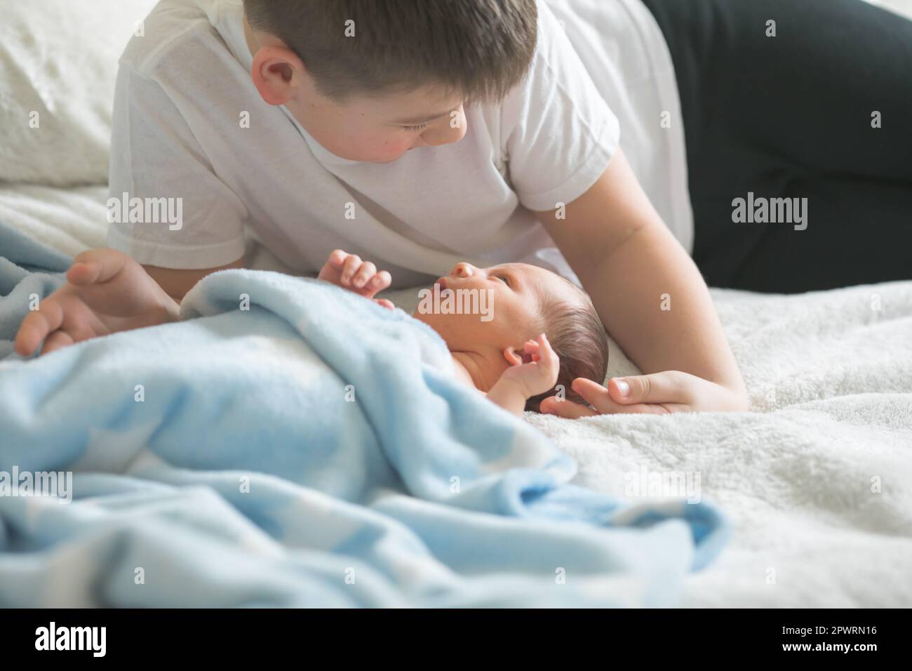 Big brother with his little newborn brother. love family concept Stock ...