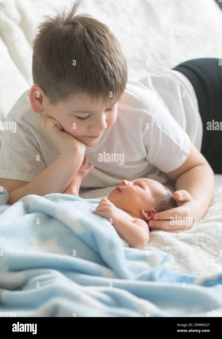 Big brother with his little newborn brother. love family concept Stock ...