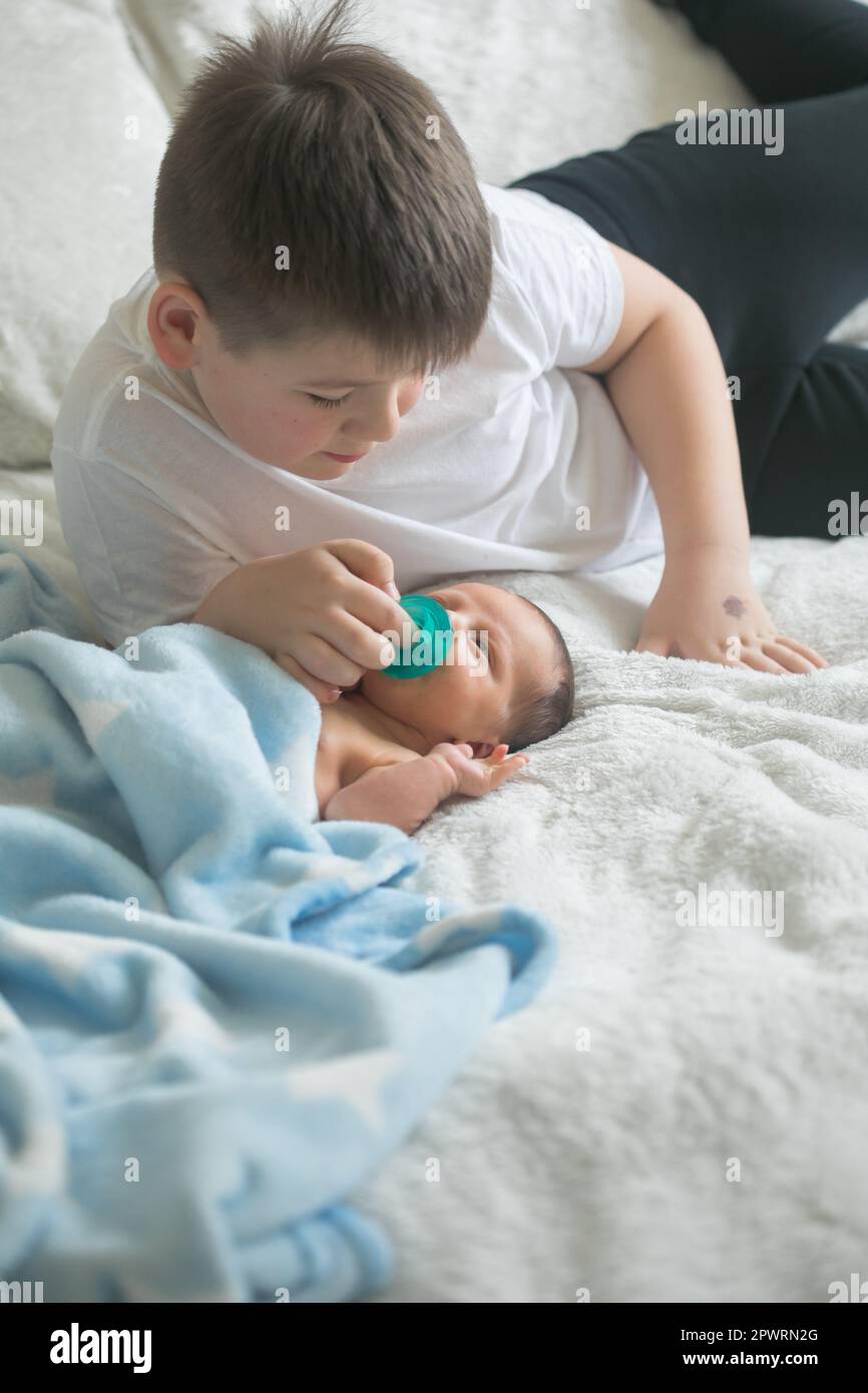 Big brother with his little newborn brother. love family concept Stock ...
