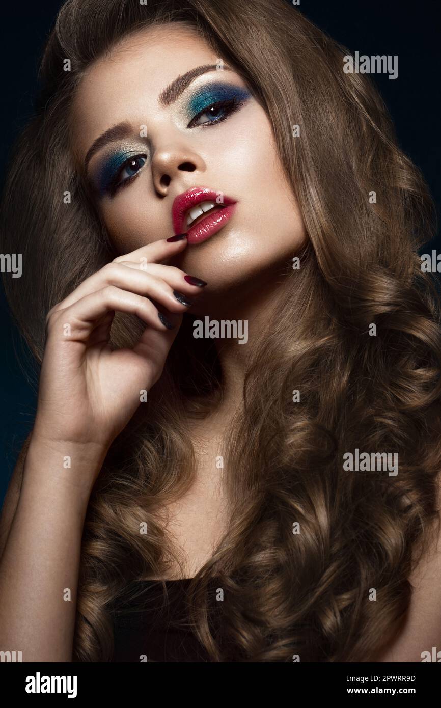 Beautiful Girl In Hollywood Manner With Curls Red Lips And Blue Make