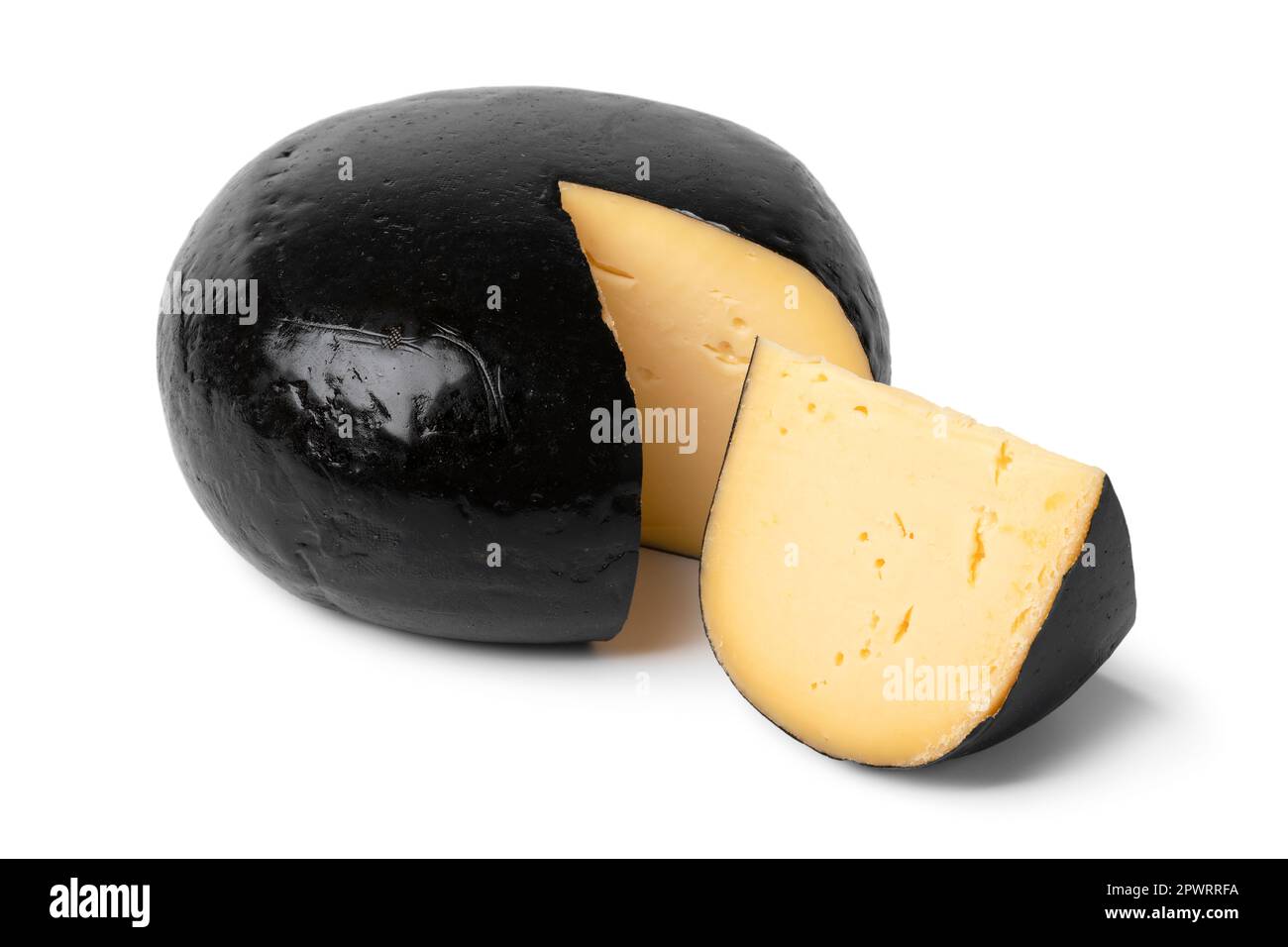 Whole Belgian Corsendonk cheese and a piece close up isolated on white ...