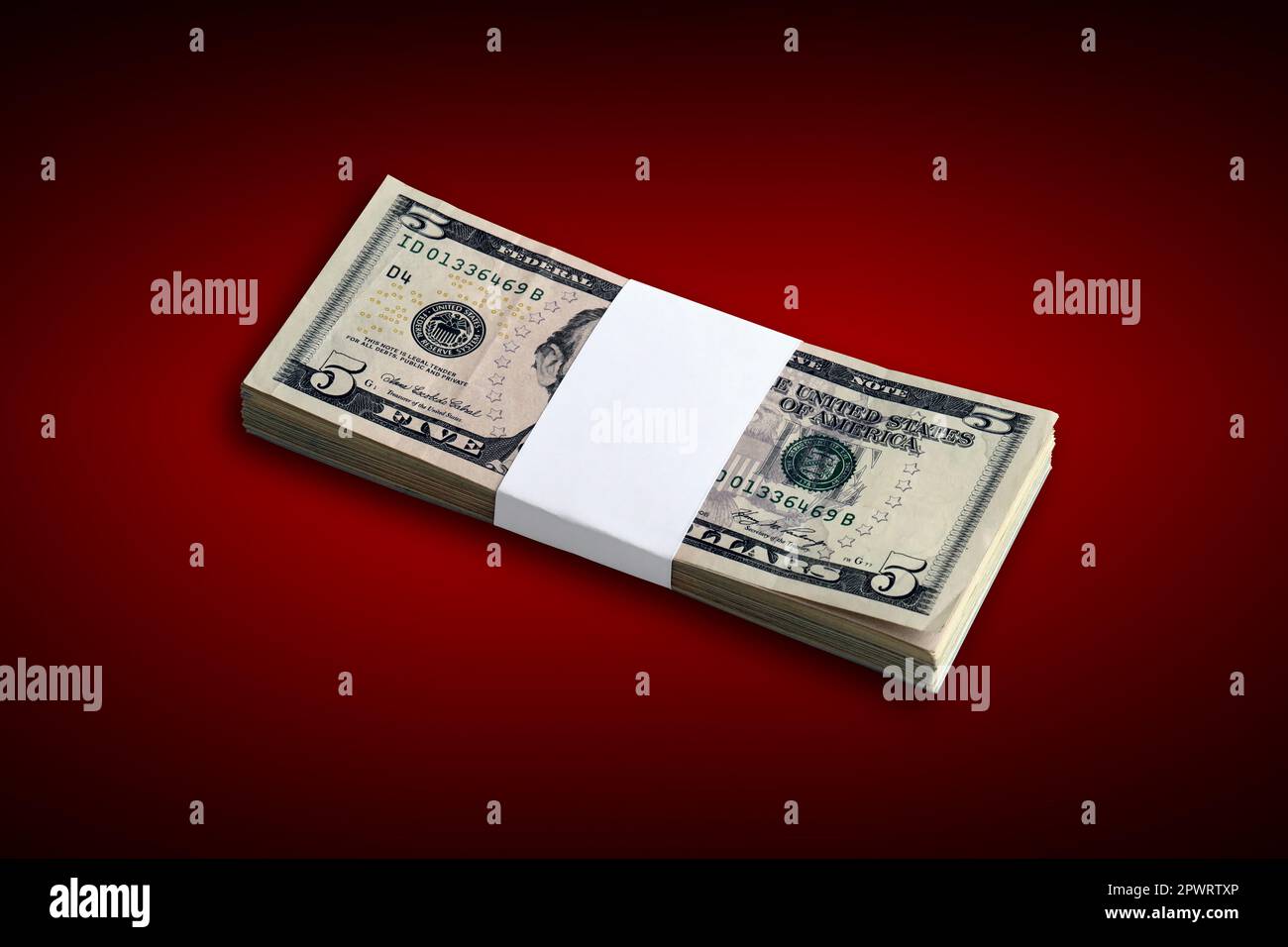 Bundle of US dollar bills on crimson red background. Pack of american ...
