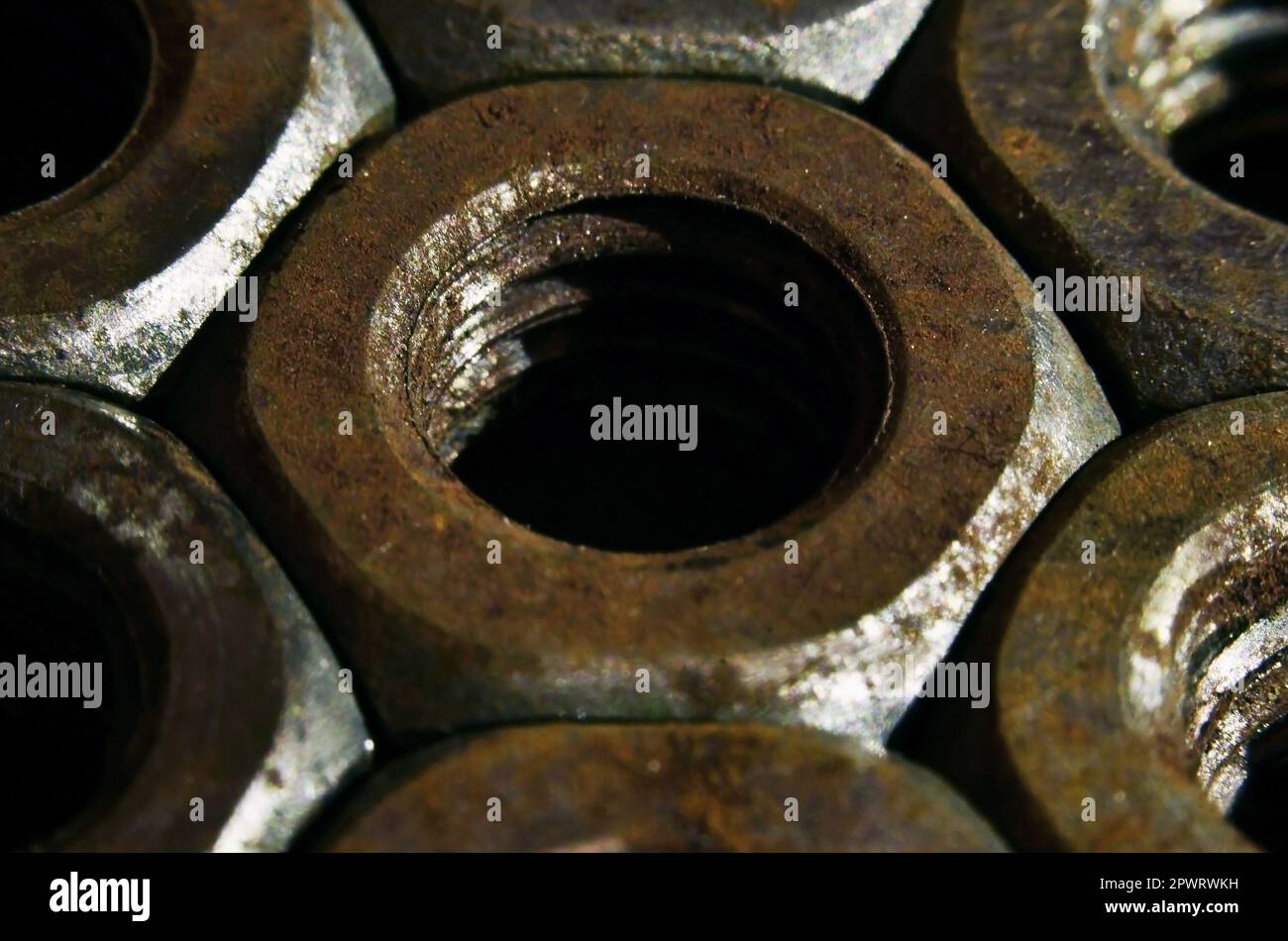 Closeup of a pile of rusty nuts. Retro industrial concept Stock Photo ...