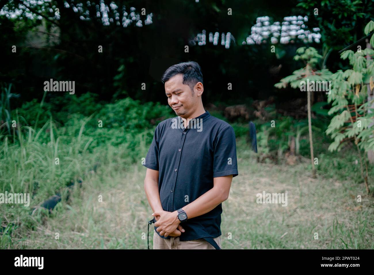 a man who looks sad because he has lost his wallet on the street Stock ...