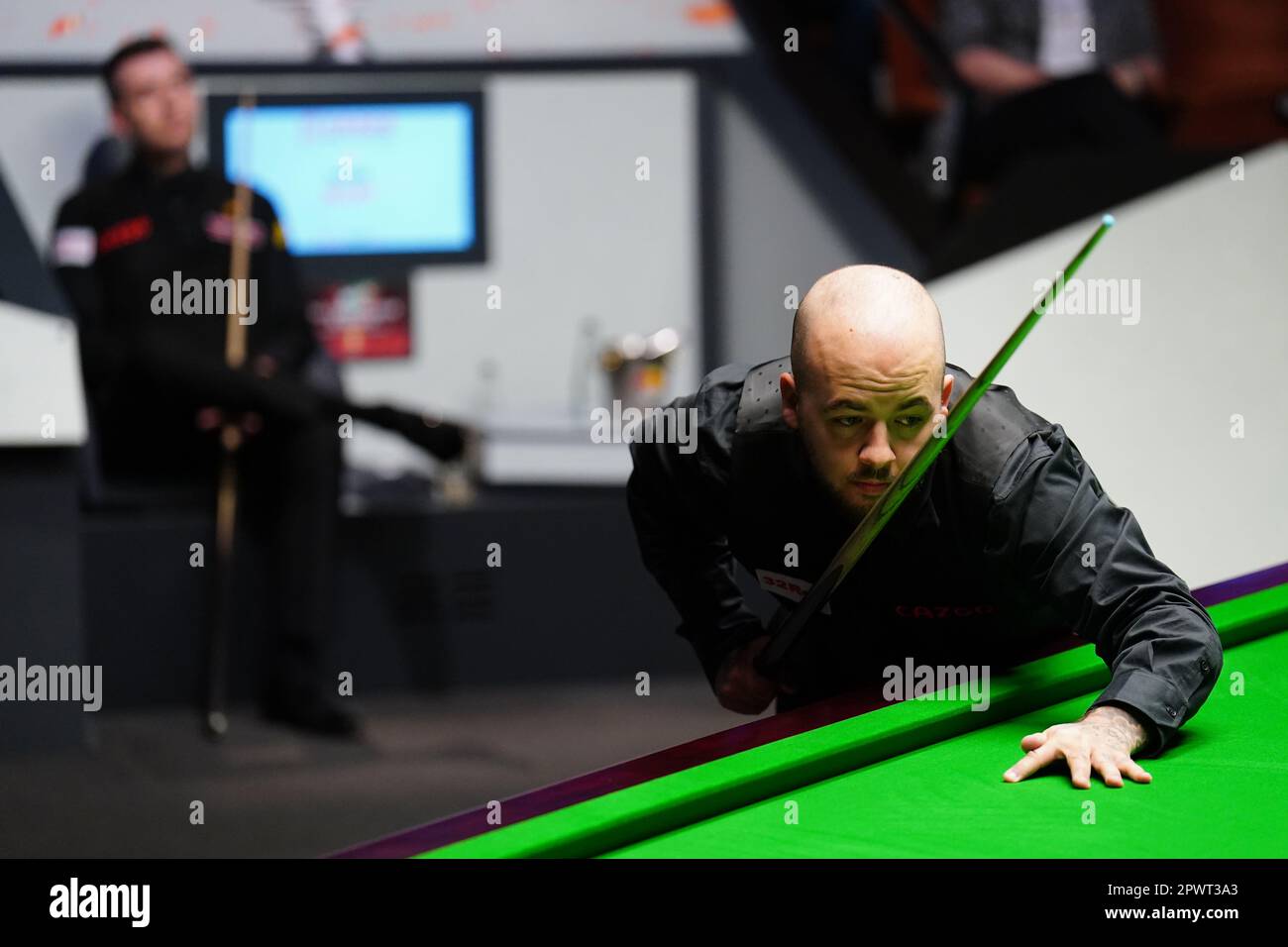 Luca Brecel in action against Mark Selby (not pictured) during the ...