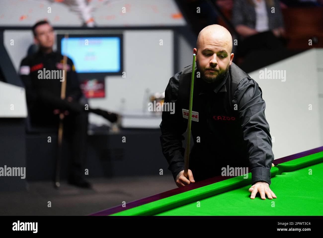 Luca Brecel in action against Mark Selby (not pictured) during the ...