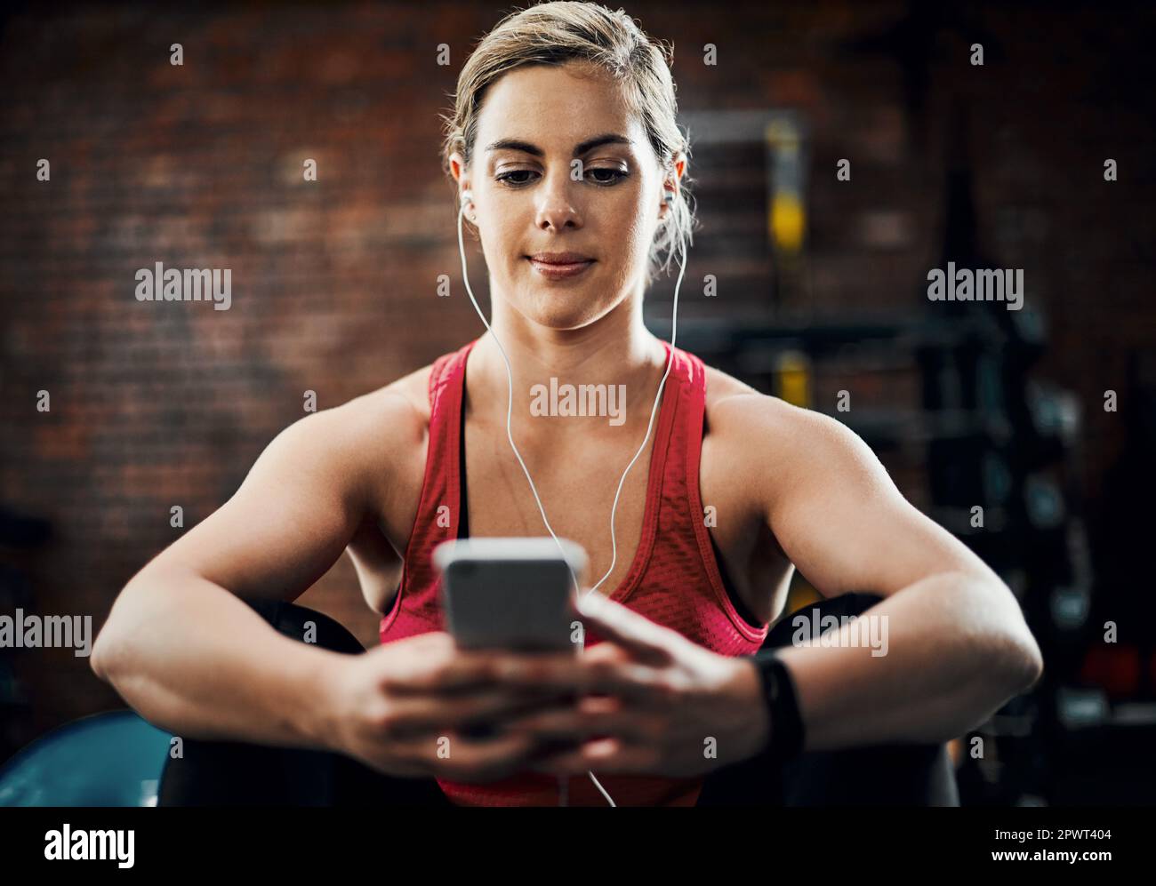 Getting her playlist ready. an attractive young female listening to ...