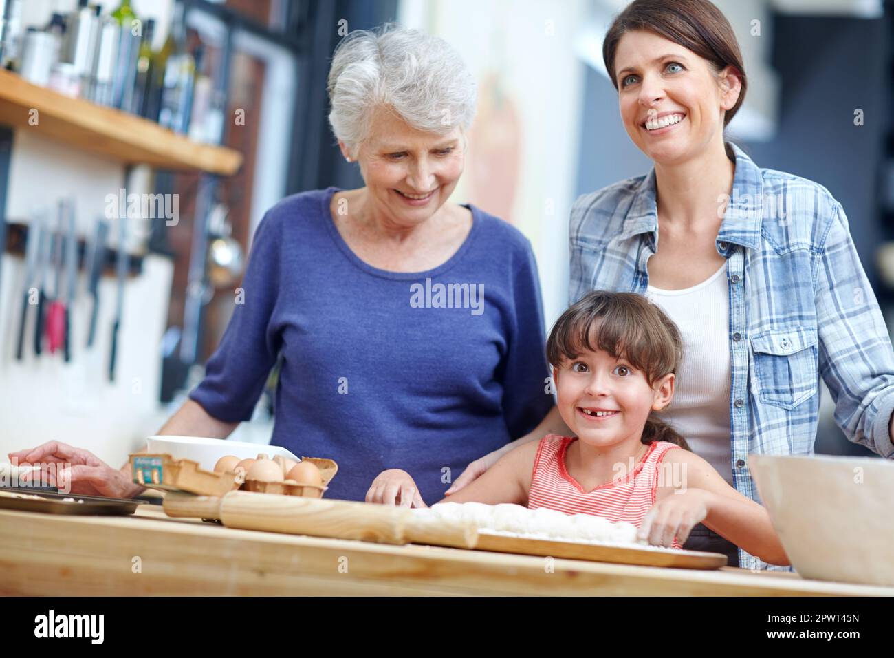 Lets start baking. a three generational family baking together Stock ...